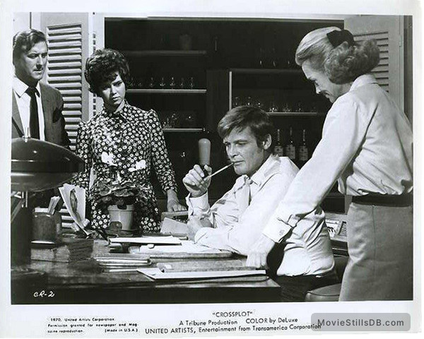 Crossplot - Publicity still of Roger Moore & Ursula Howells